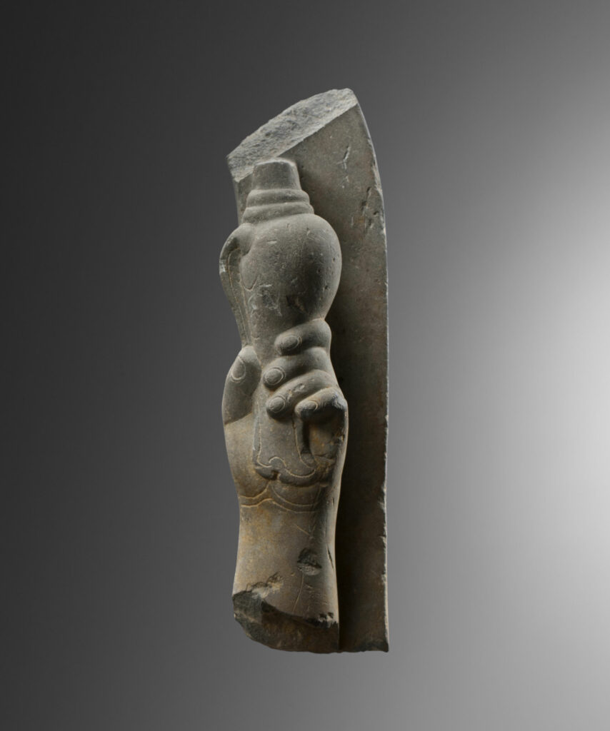 Hand holding a Sankha Conch Shell Trumpet - GRUSENMEYER & WOLINER